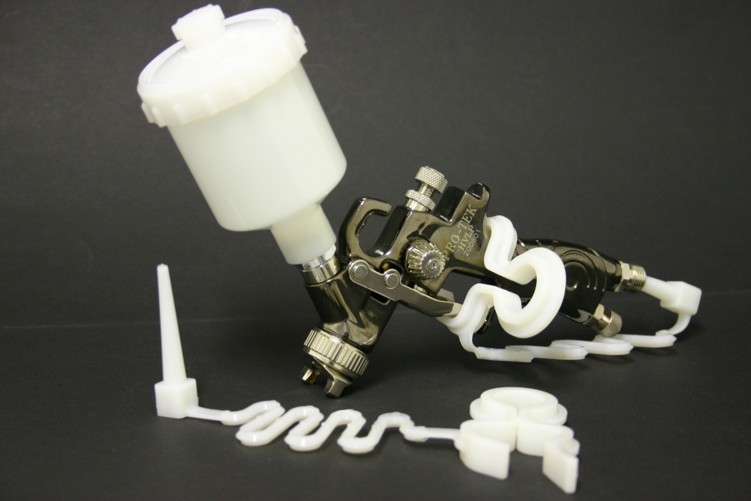 Trigger-clamp for spray-gun cleaning | I.N.P. Quality B.V.